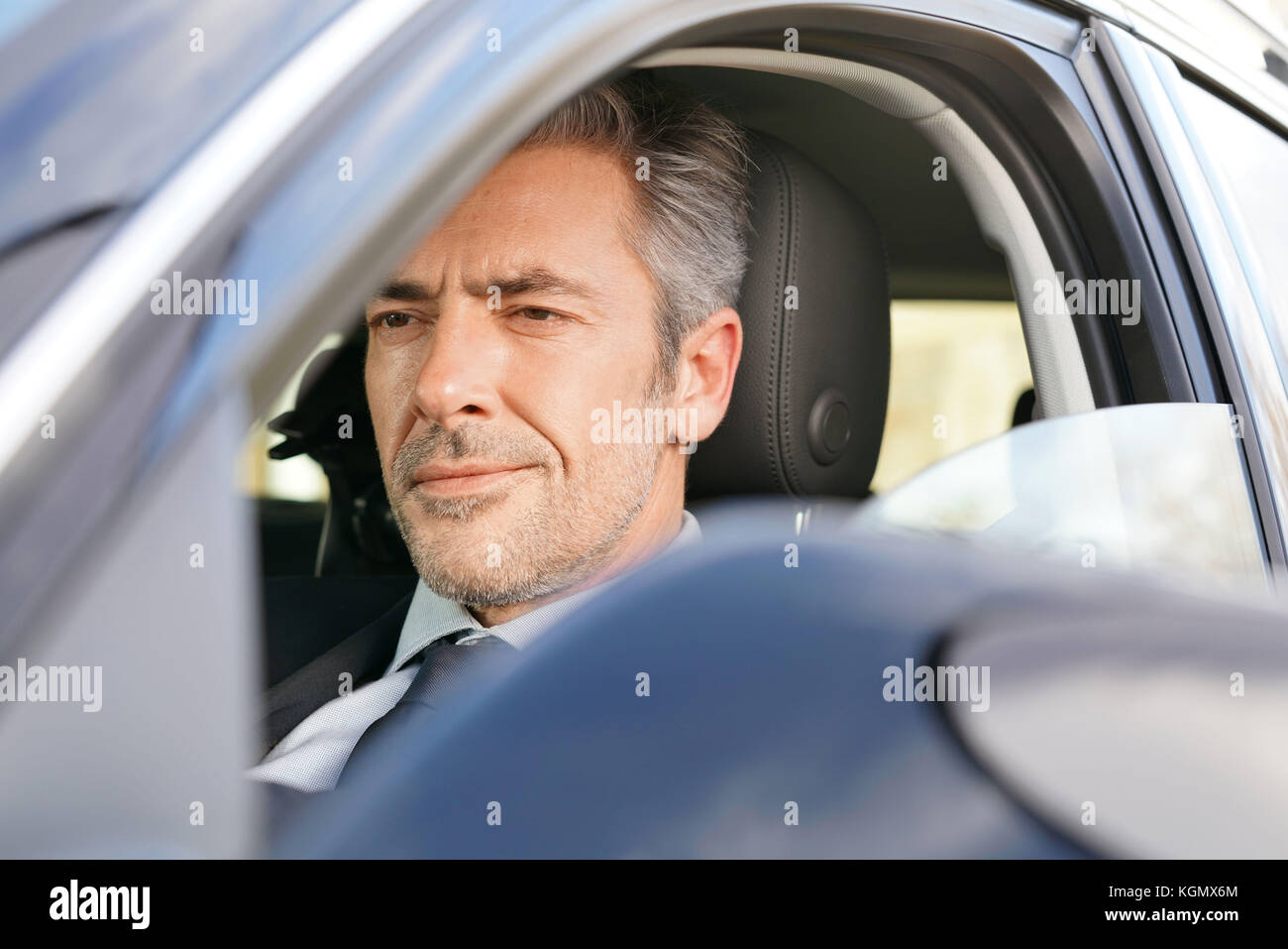 Private driver inside car waiting for client Stock Photo - Alamy