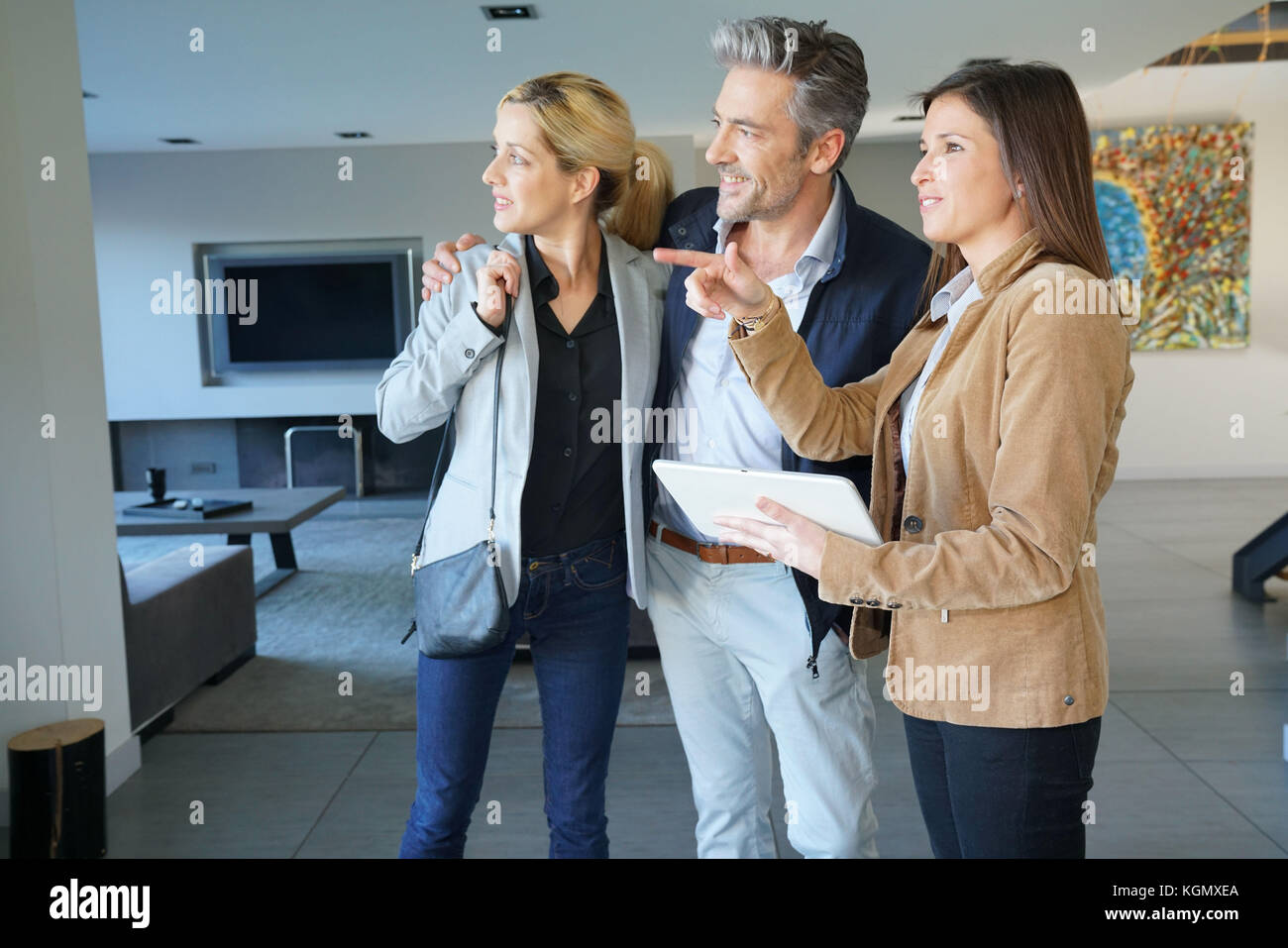 Couple visiting home with real-estate agent Stock Photo - Alamy