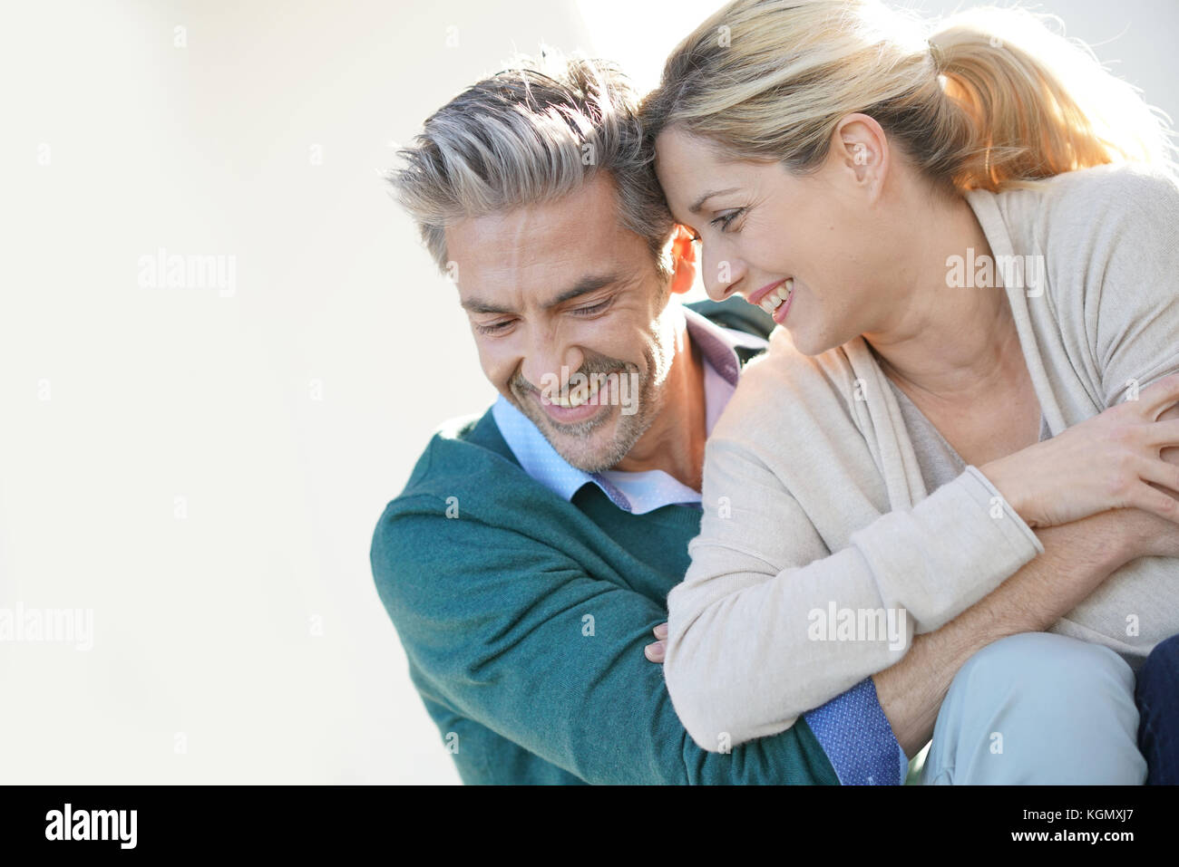 Middle-aged couple embracing each other Stock Photo - Alamy