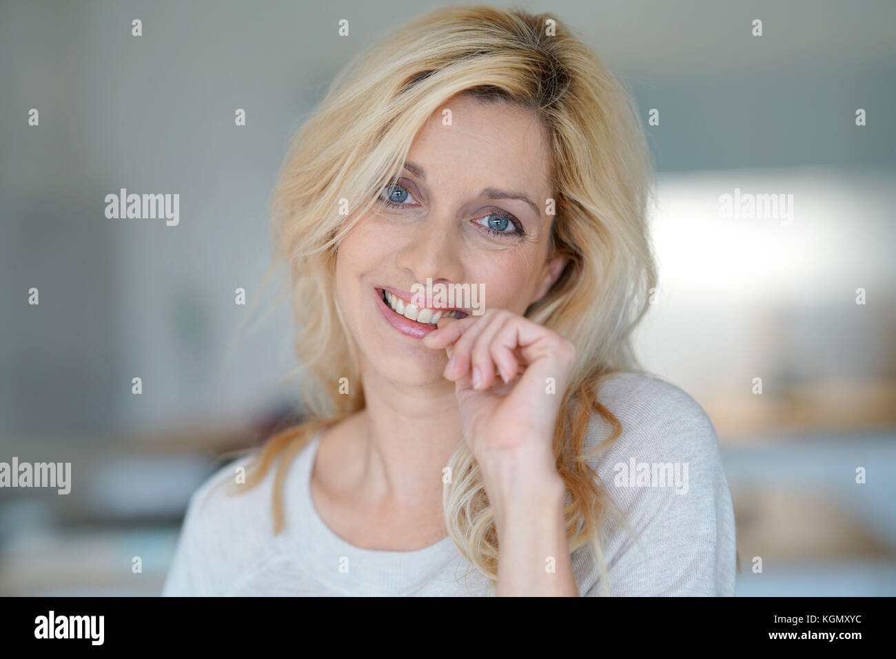 portrait of cheerful middle-aged blond woman Stock Photo - Alamy