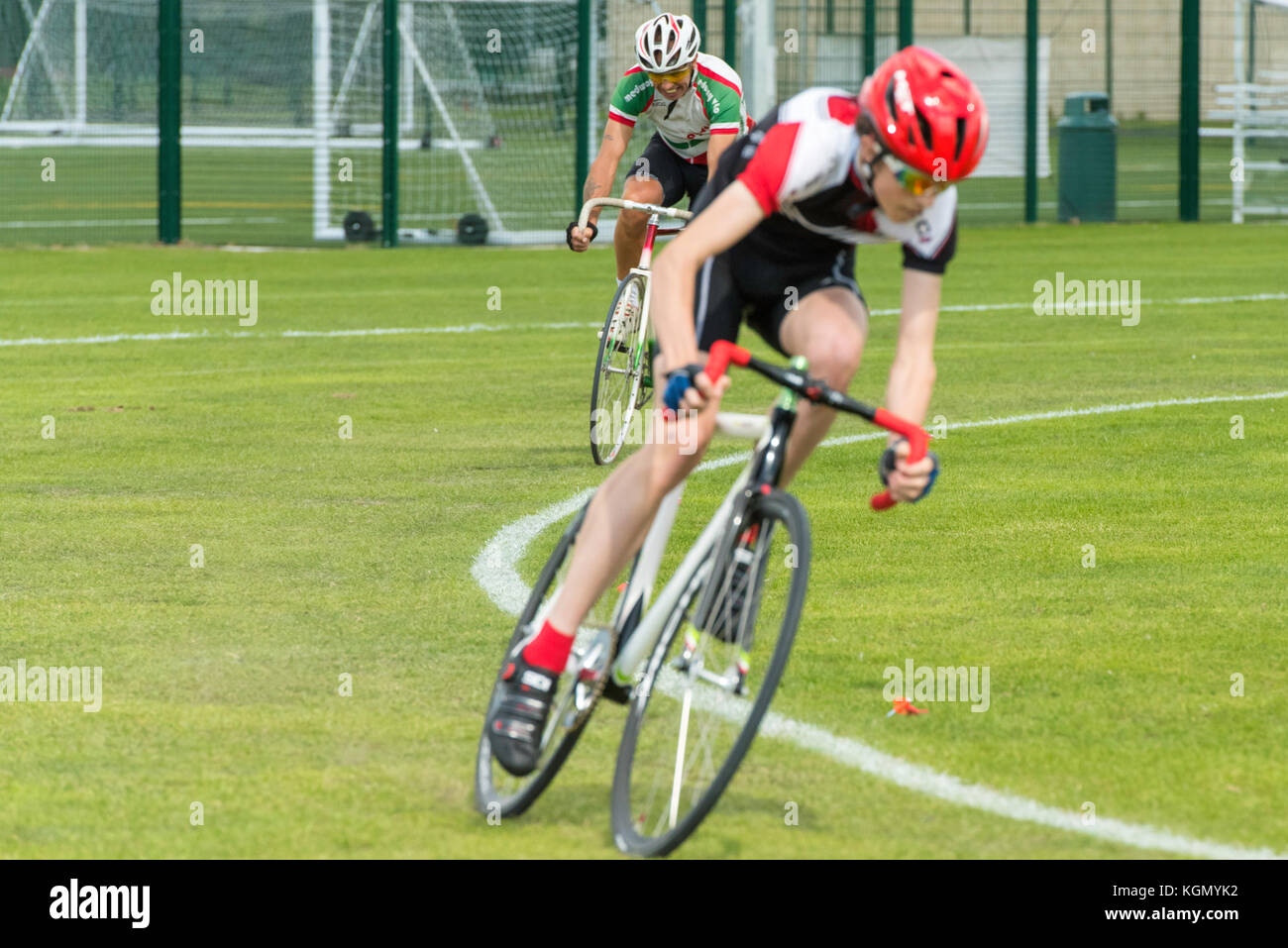Male grass track cyclists racing in a competition at Kent University ...
