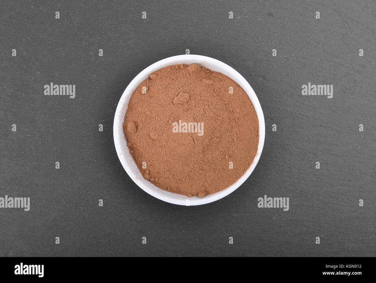 Bowl with cocoa powder on shale Stock Photo - Alamy