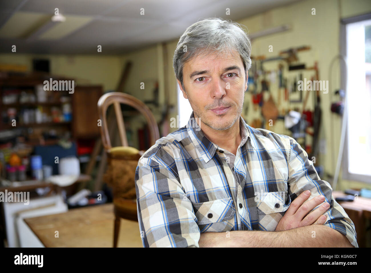 Portrait of craftsman in workshop Stock Photo - Alamy