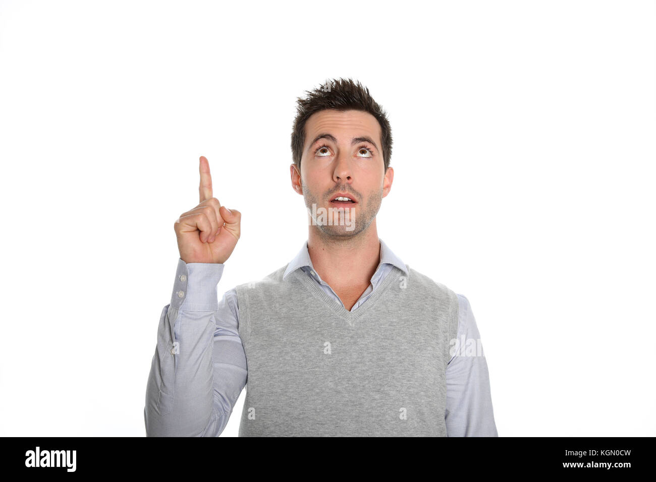 Cheerful guy showing text on white background Stock Photo - Alamy