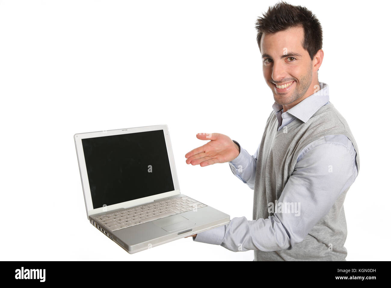 Successful man showing laptop screen to camera Stock Photo - Alamy