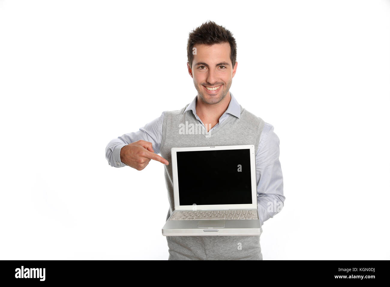 Successful man showing laptop screen to camera Stock Photo - Alamy