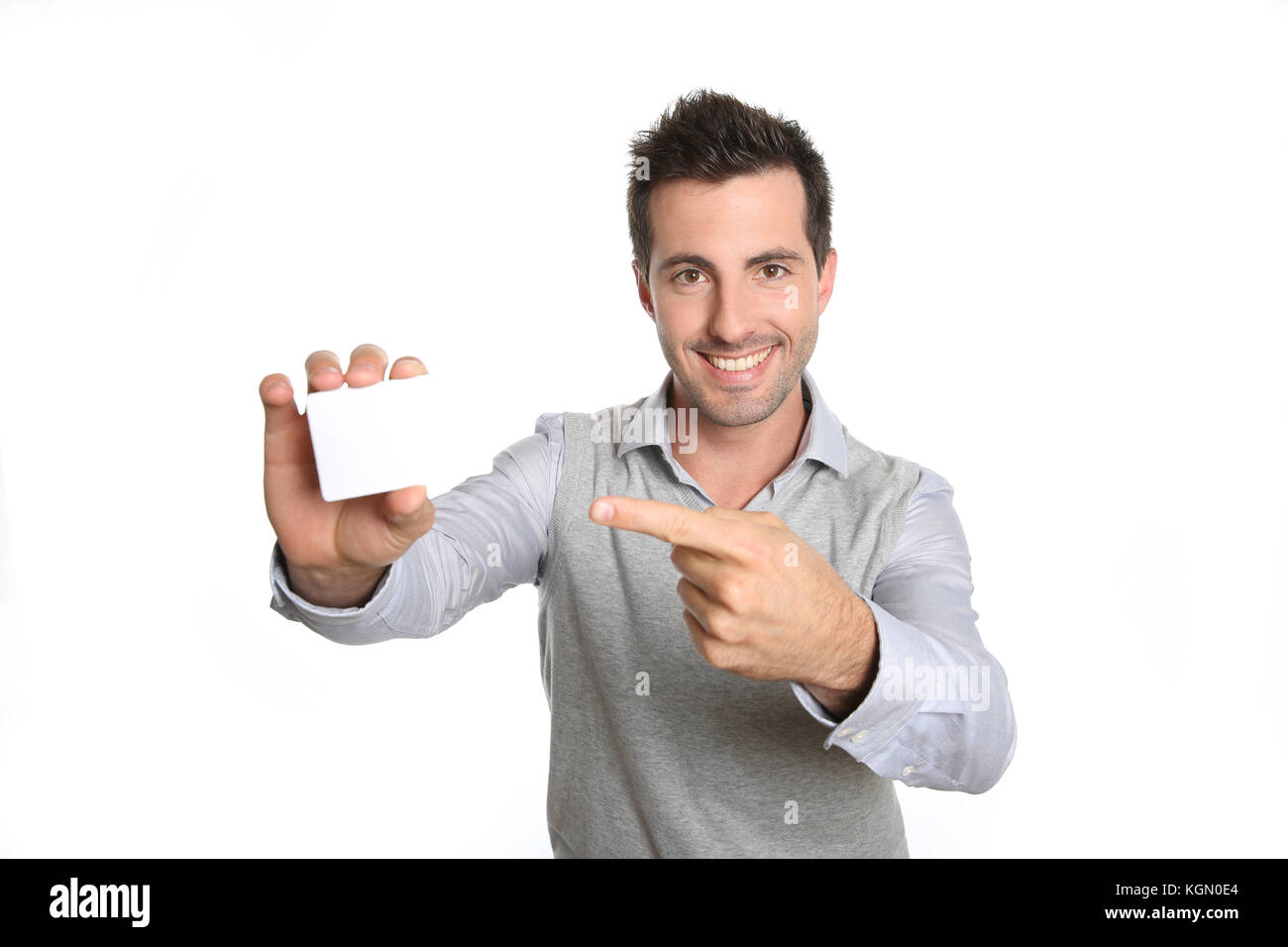 Handsome smiling man showing card Stock Photo - Alamy