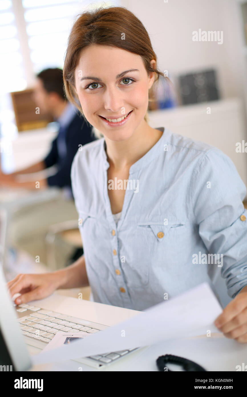 Young woman working on desktop colputer Stock Photo - Alamy