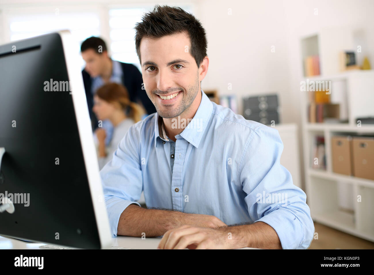 Man in office working on desktop computer Stock Photo - Alamy