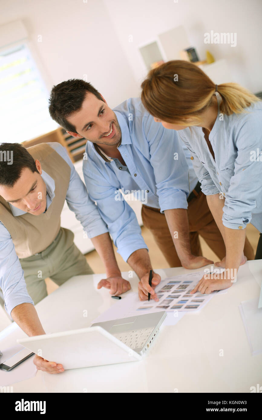 Creative team selecting image shots Stock Photo - Alamy