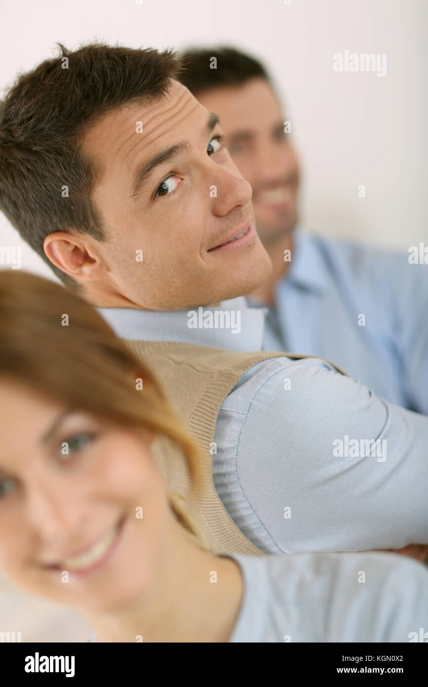Successful and cheerful man with workmates Stock Photo - Alamy