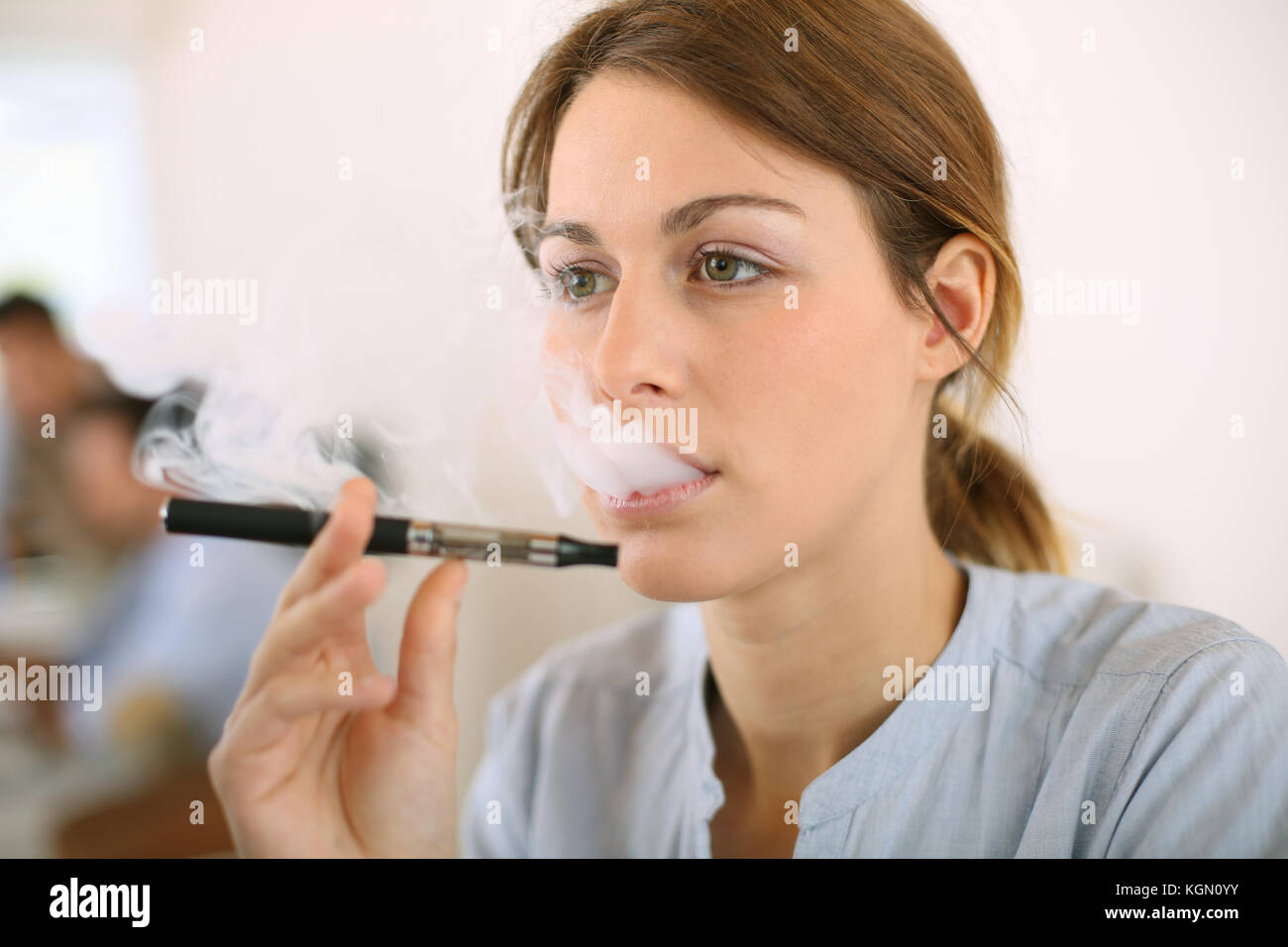 Blond female smoking cigarette hi-res stock photography and images - Alamy