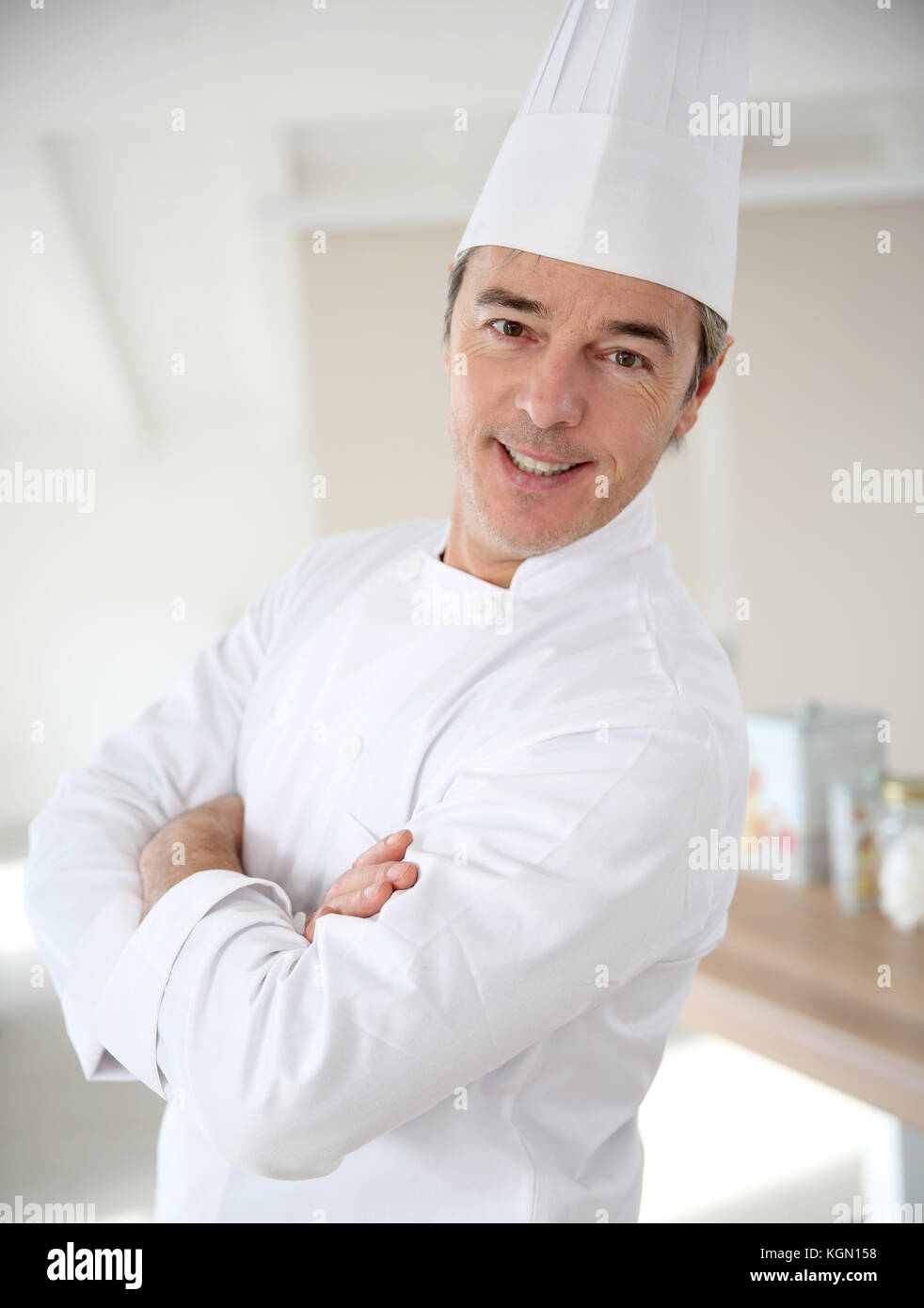 Portrait of chef standing in restaurant kitchen Stock Photo - Alamy