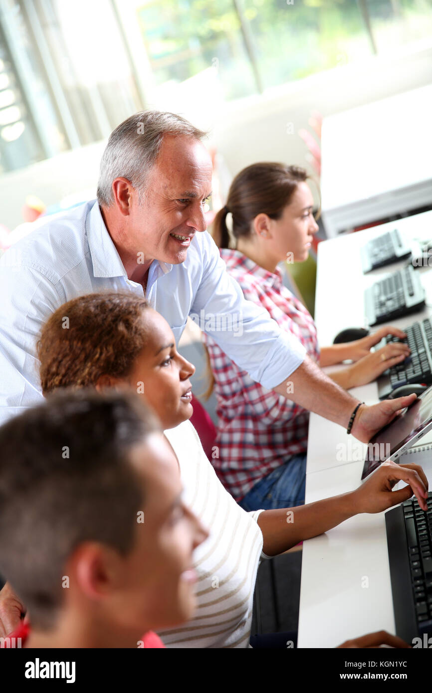 Instructor in training class with students Stock Photo - Alamy