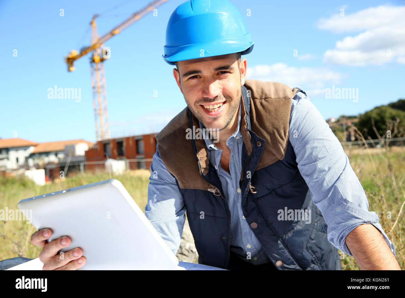 Engineer using tablet by construction site Stock Photo - Alamy
