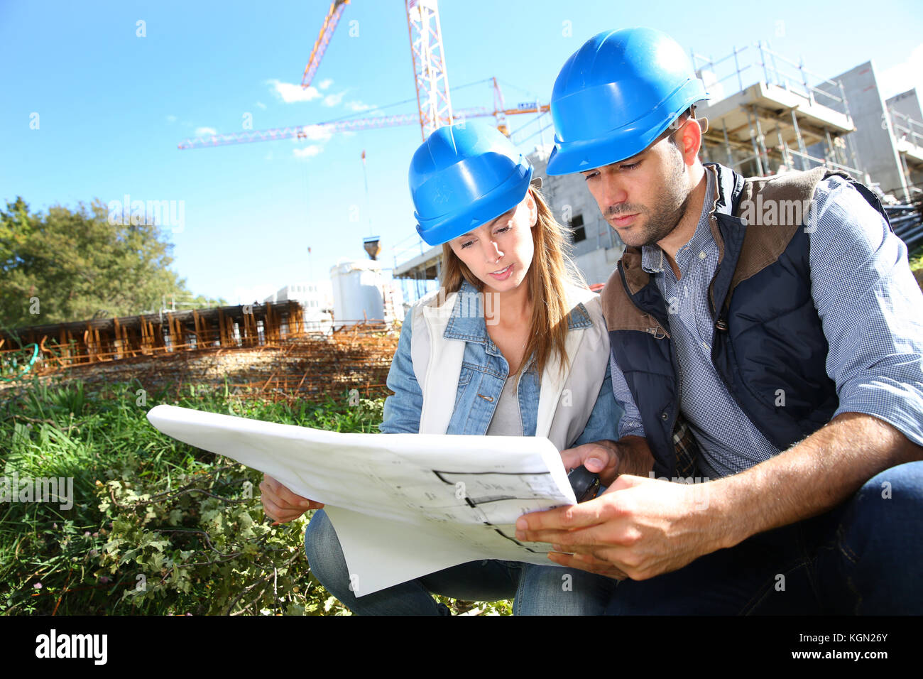 Construction engineers working together on site Stock Photo - Alamy