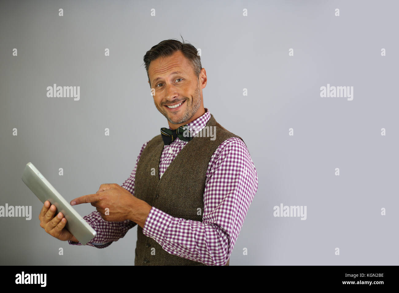 Guy holding tablet hi-res stock photography and images - Alamy