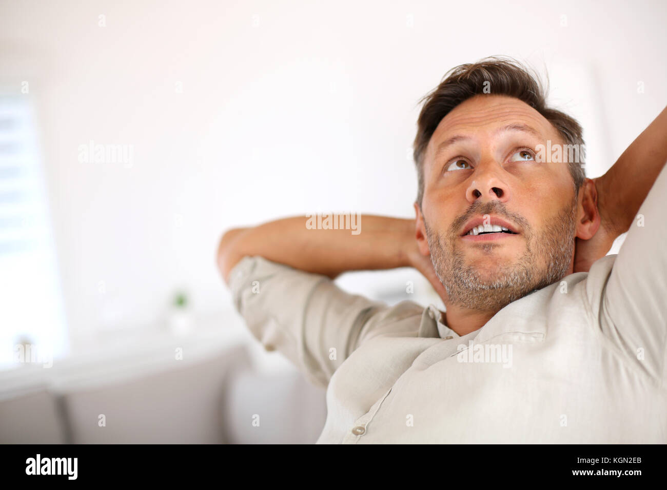 Male model arms behind head hi-res stock photography and images - Alamy
