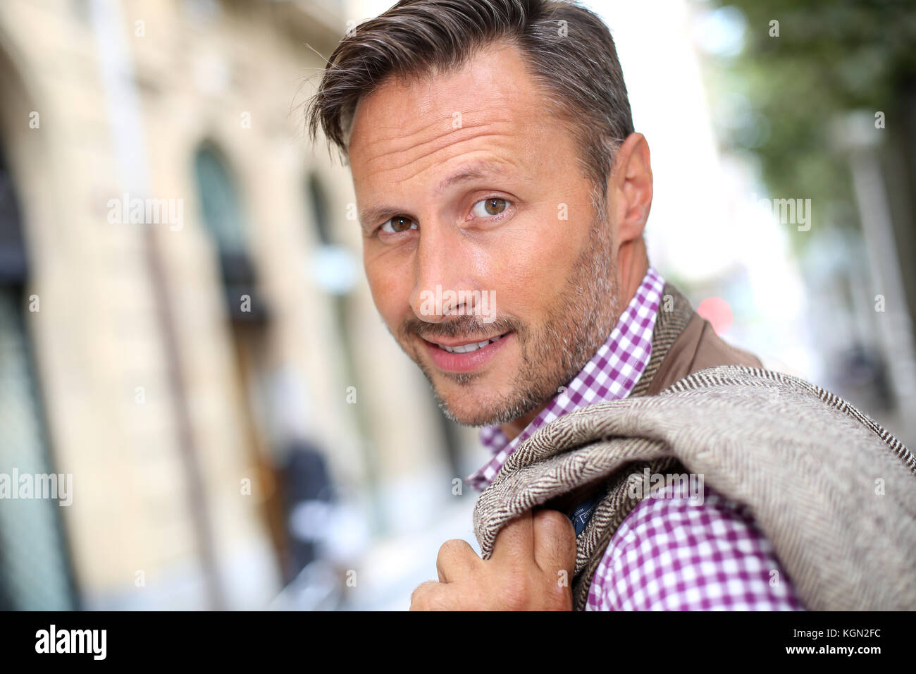 Portrait of elegant smiling man going to work Stock Photo - Alamy