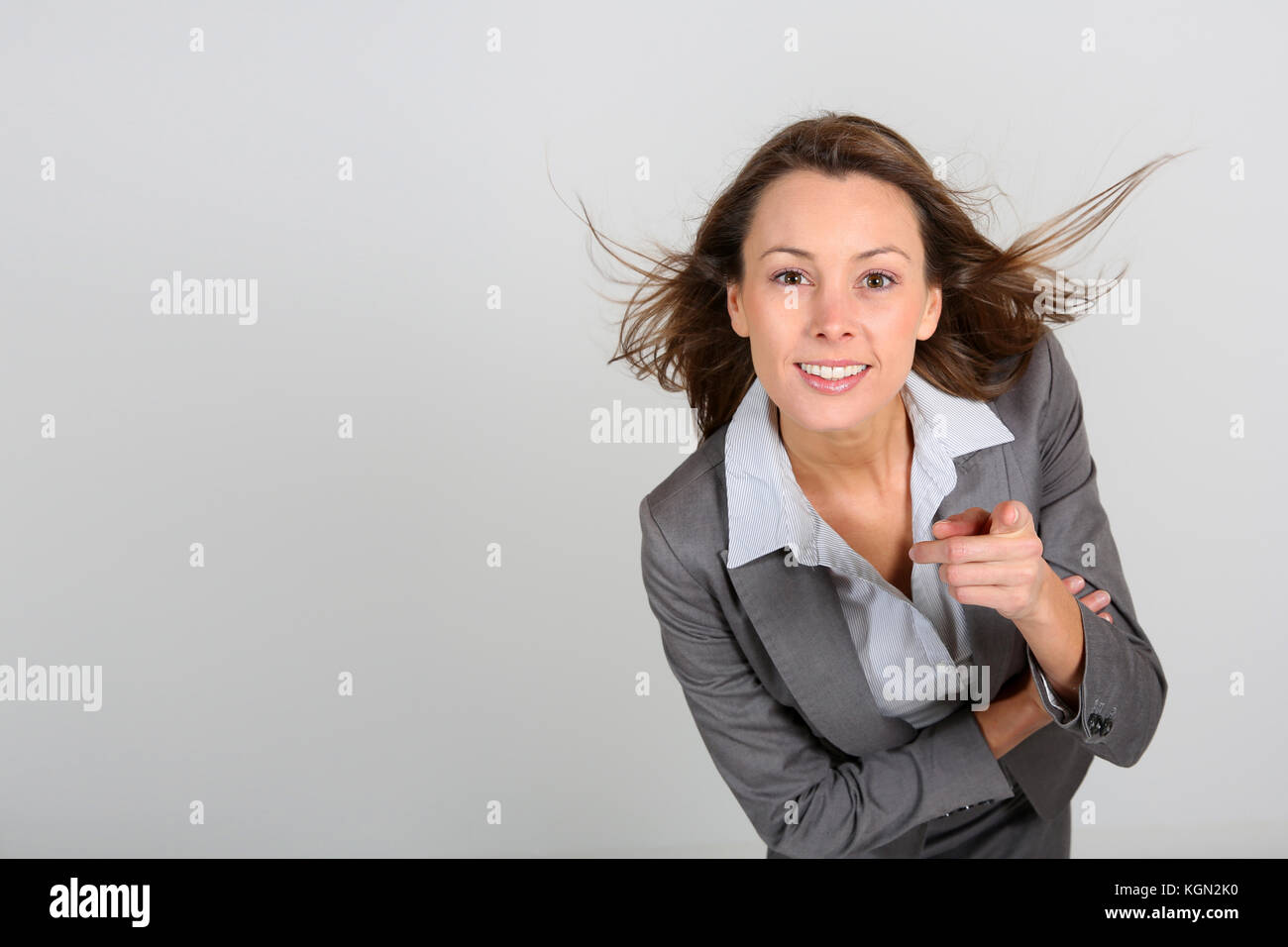 Successful business girl leaning towards camera Stock Photo - Alamy