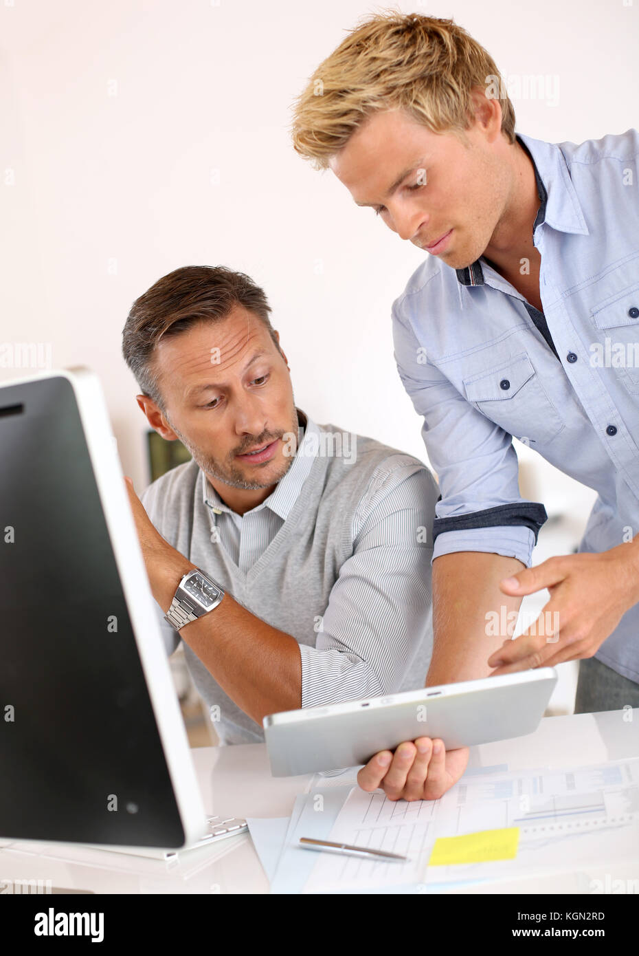 Business people in office working on desktop Stock Photo - Alamy