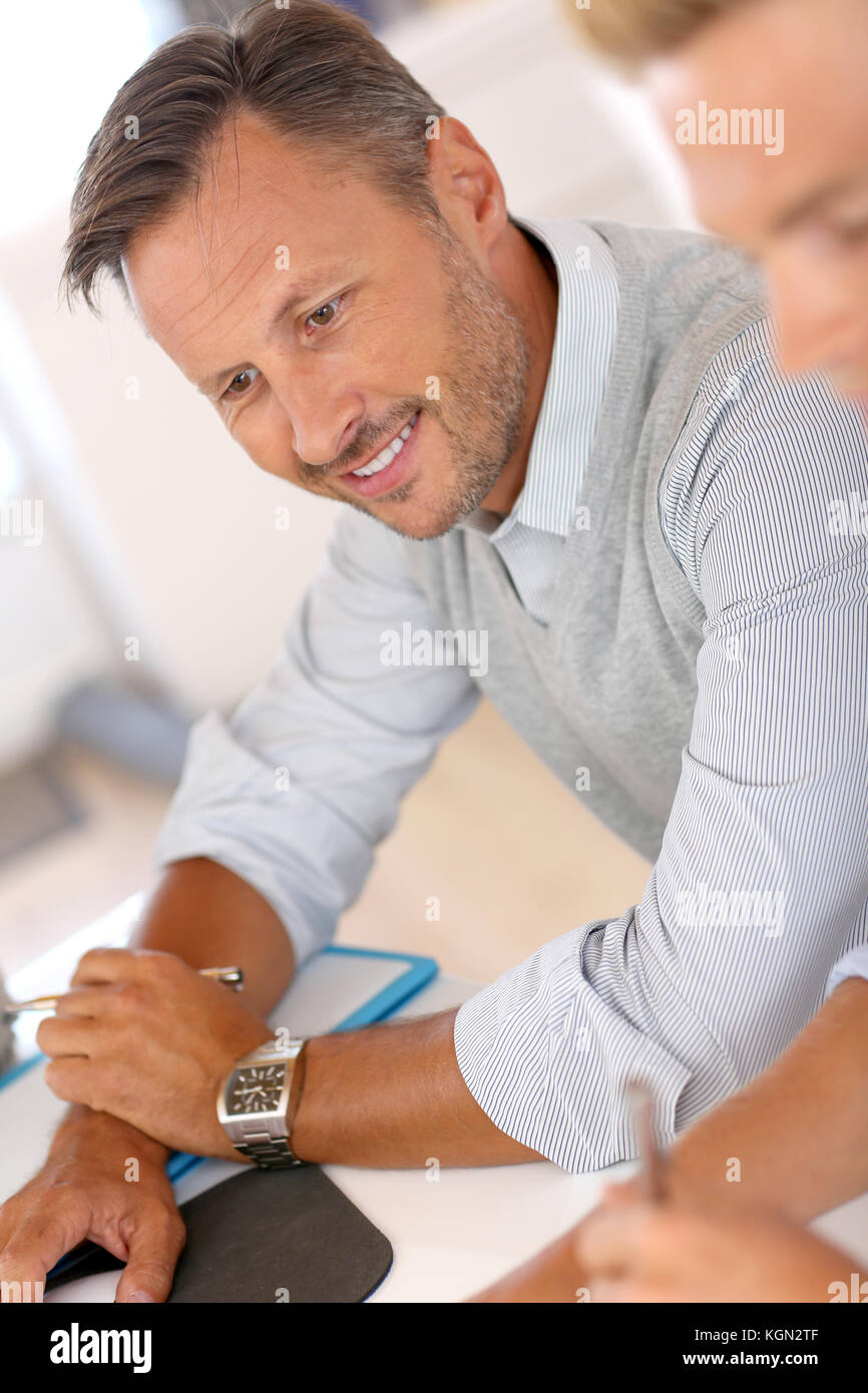 Portrait of middle-aged man working in office Stock Photo - Alamy