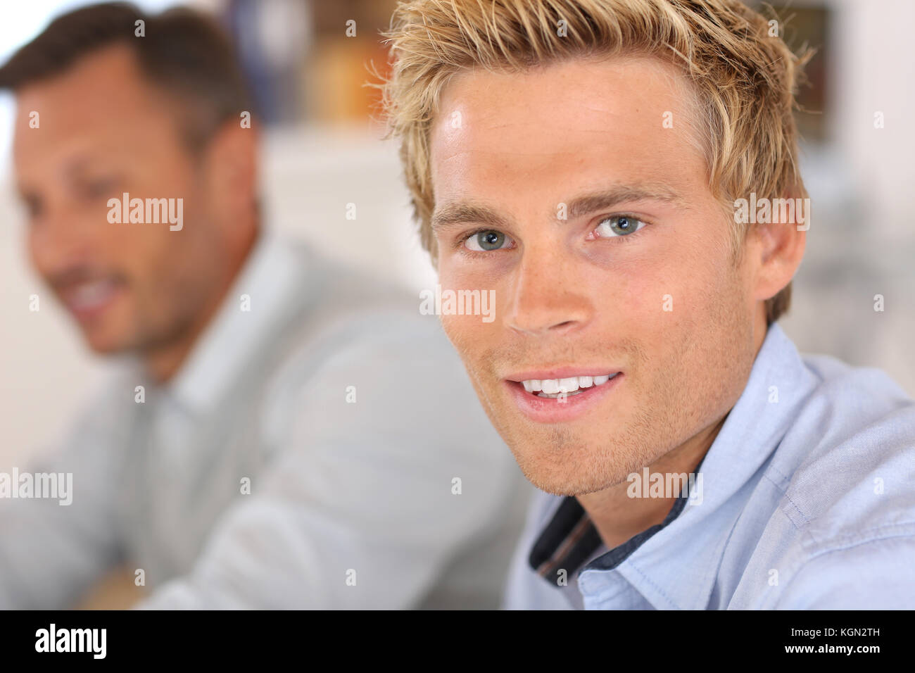 Portrait of smiling handsome man at work Stock Photo - Alamy