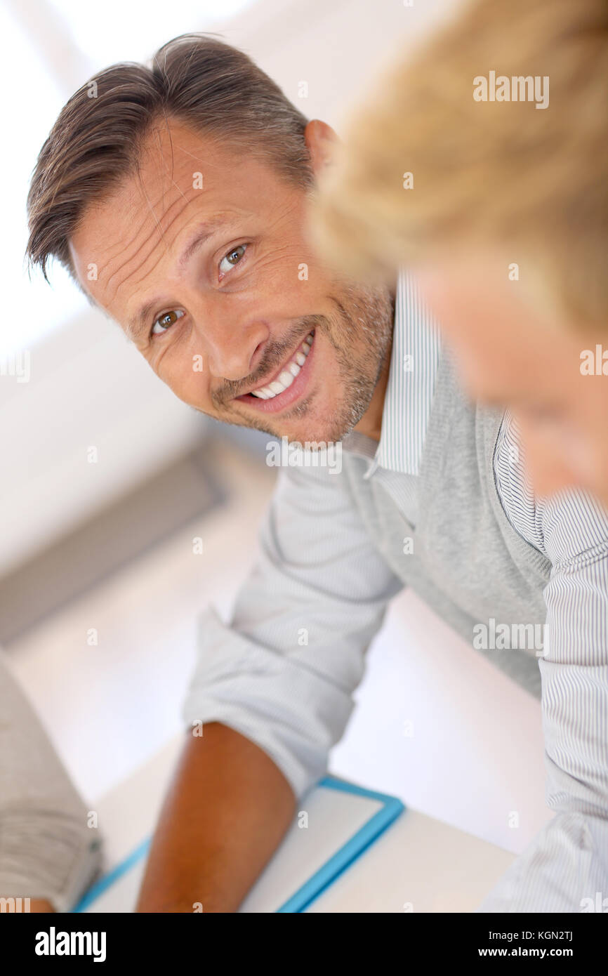 Portrait of middle-aged man working in office Stock Photo - Alamy