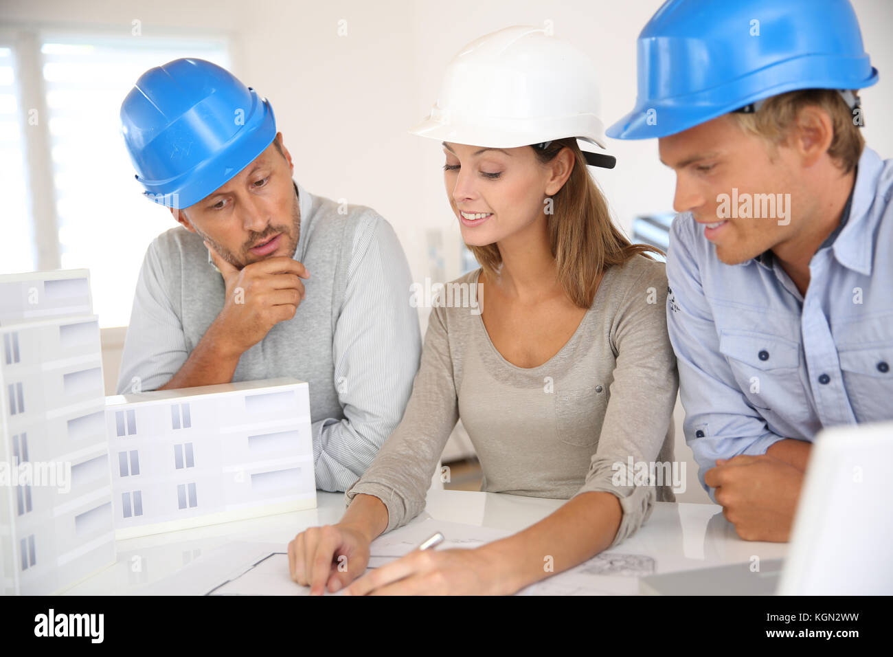 Construction people working on project Stock Photo - Alamy