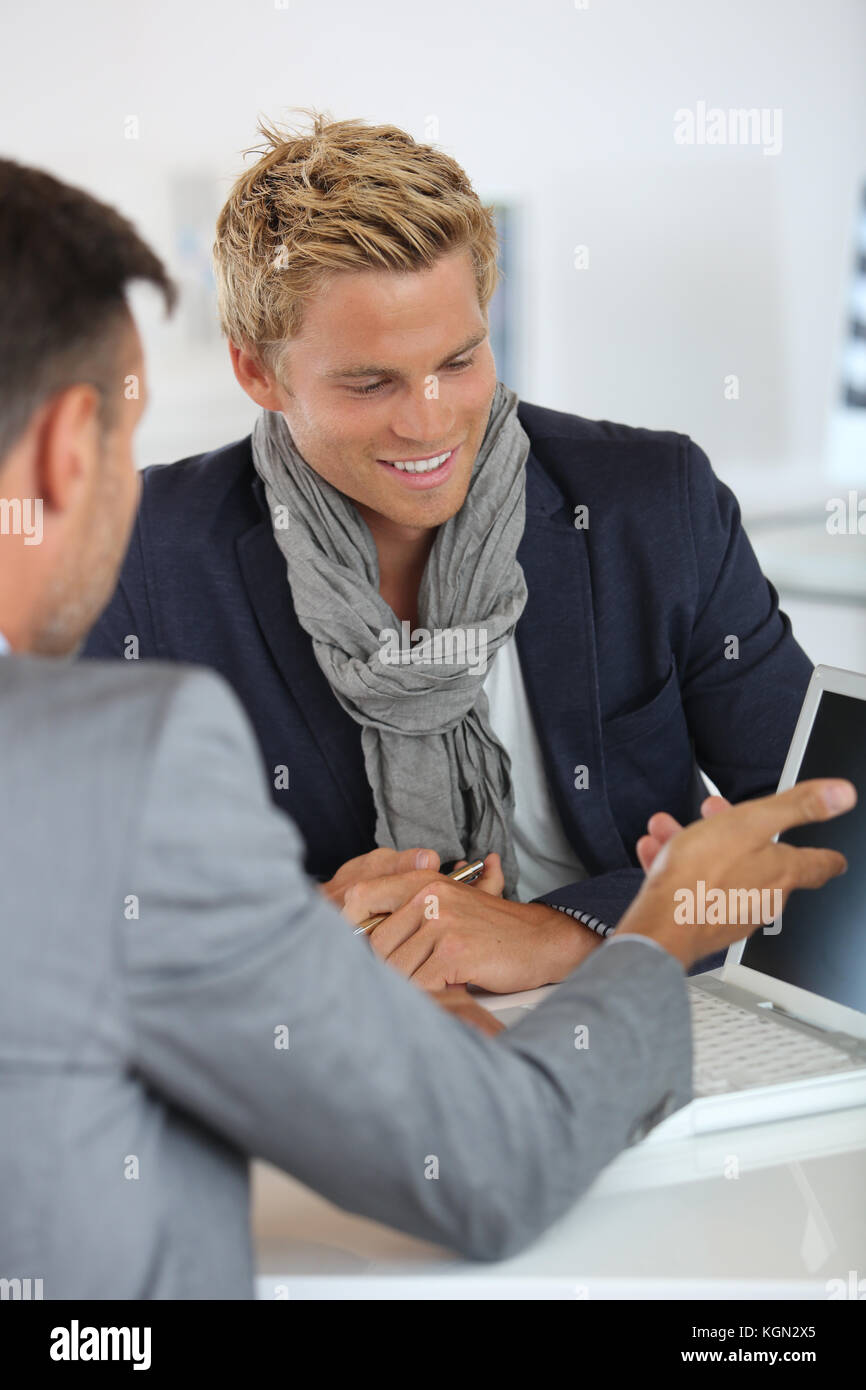 Smiling financial adviser young hi-res stock photography and images - Alamy