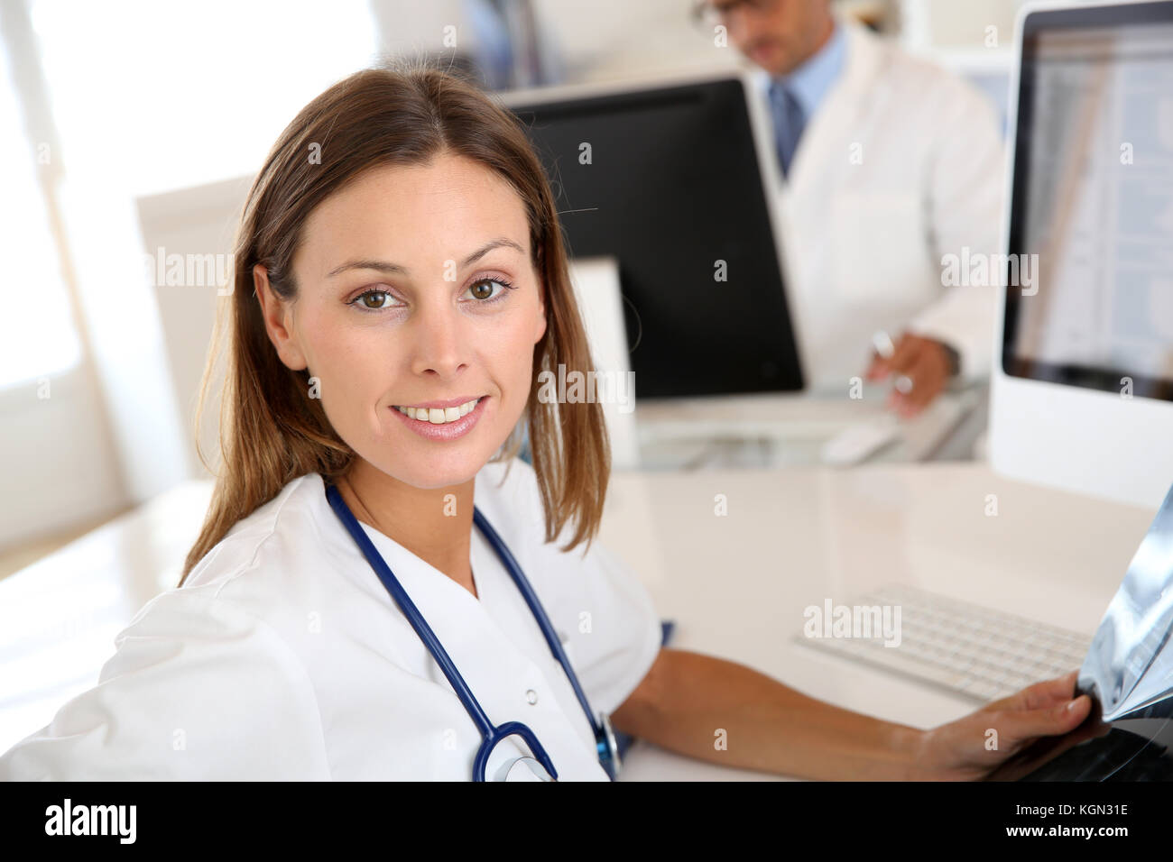 Beautiful nurse working in hospital office Stock Photo - Alamy