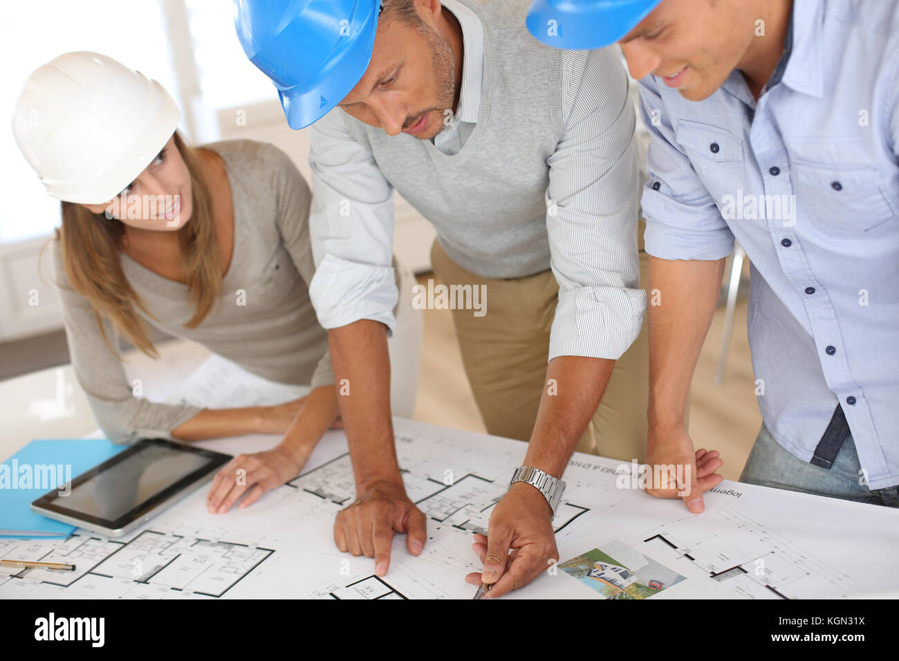 Construction people working on project Stock Photo - Alamy