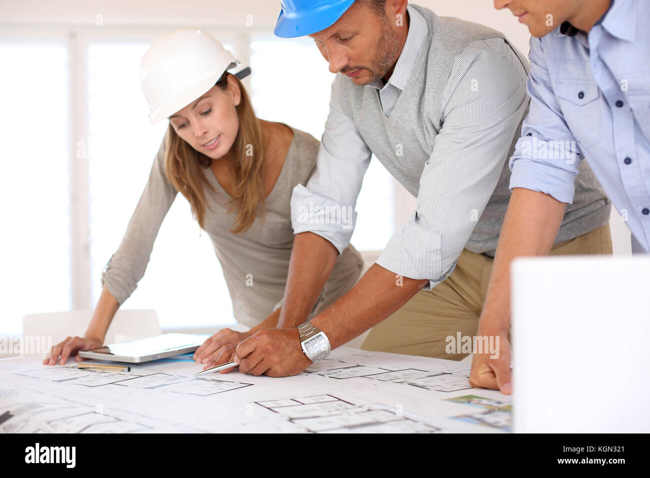 Construction people working on project Stock Photo - Alamy