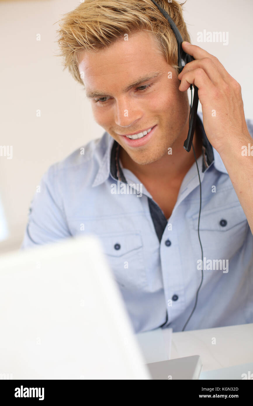Smiling attractive customer service representative Stock Photo - Alamy