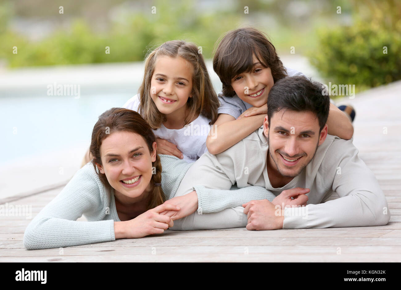 Laying by the pool hi-res stock photography and images - Alamy