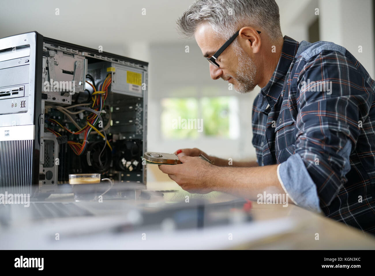 Technician repairing computer hardware Stock Photo - Alamy