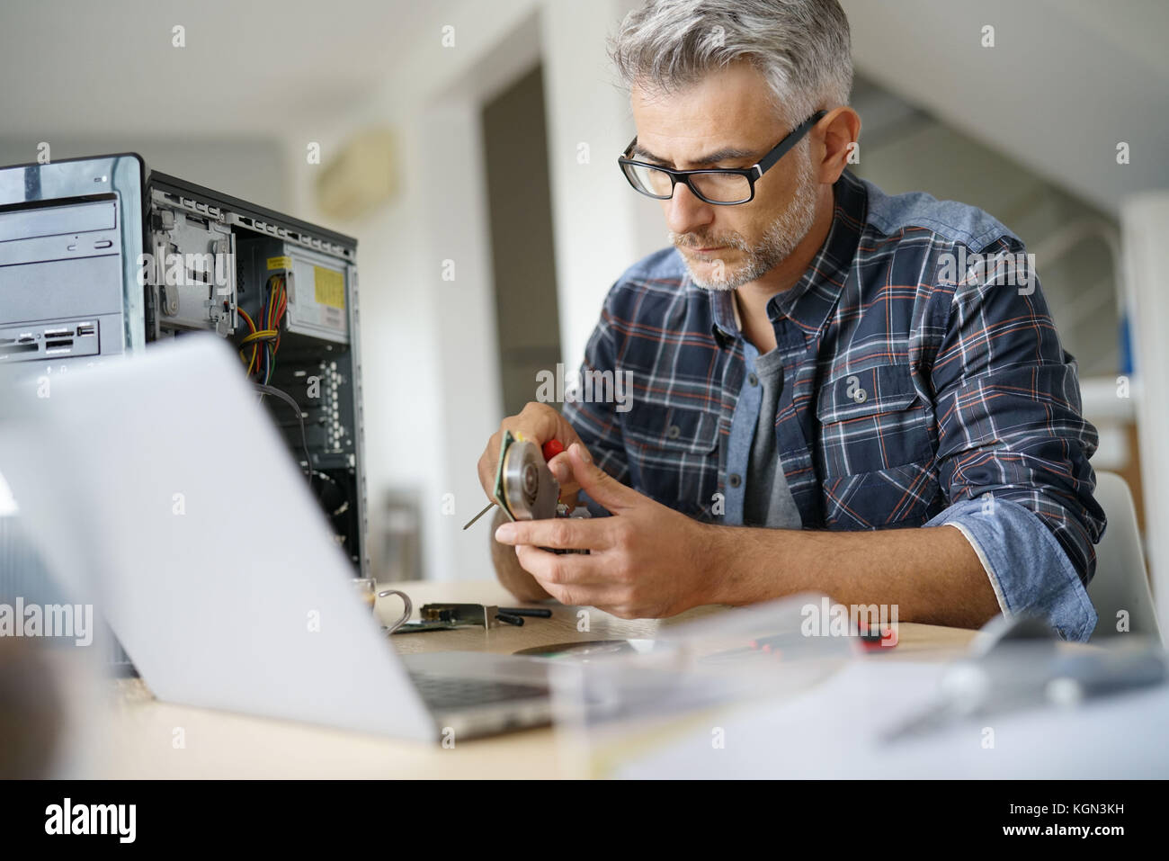 Technician repairing computer hardware Stock Photo - Alamy
