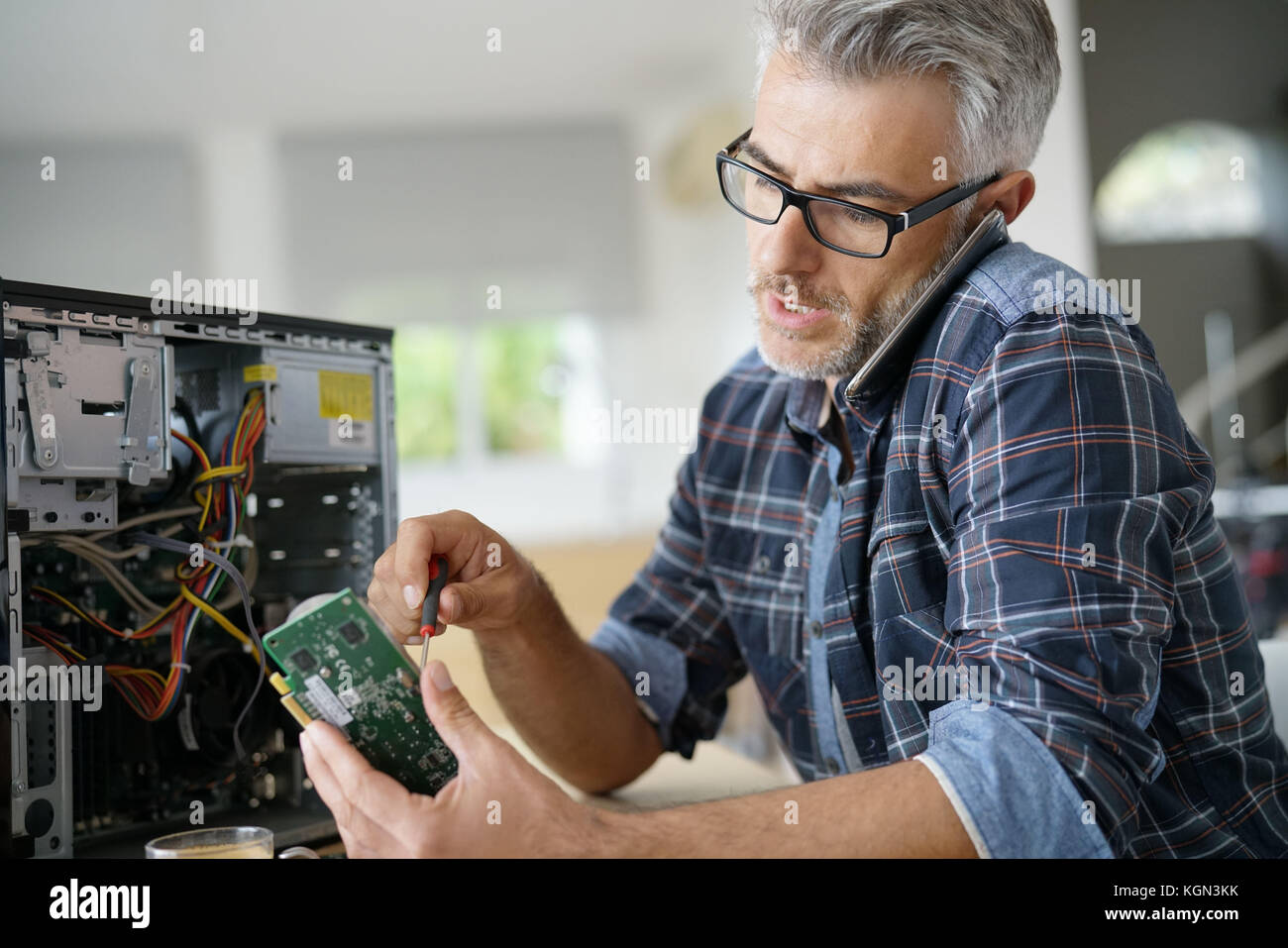 Technician repairing computer hardware Stock Photo - Alamy