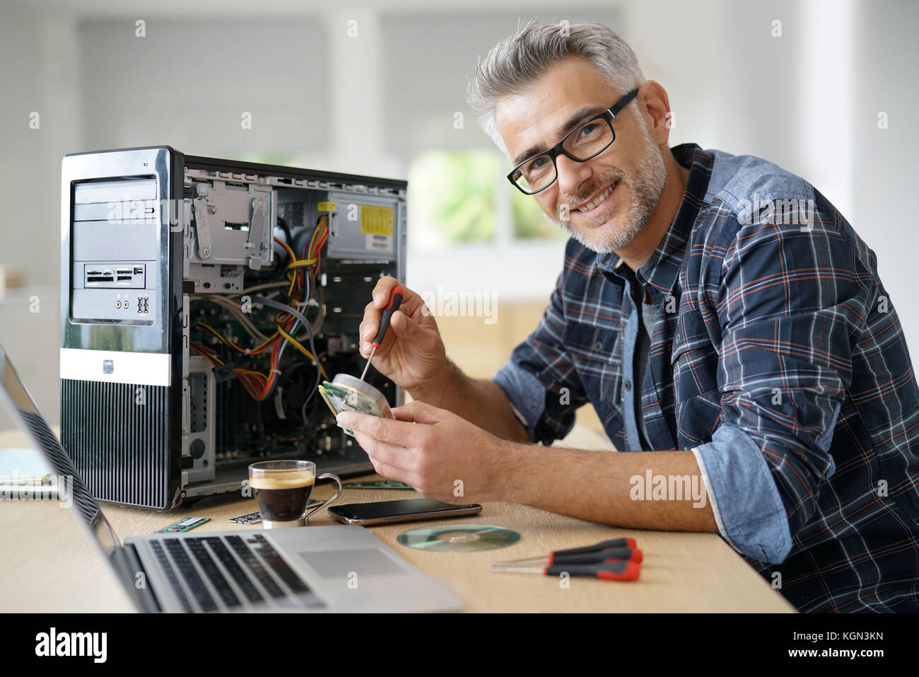 Technician repairing computer hardware Stock Photo - Alamy