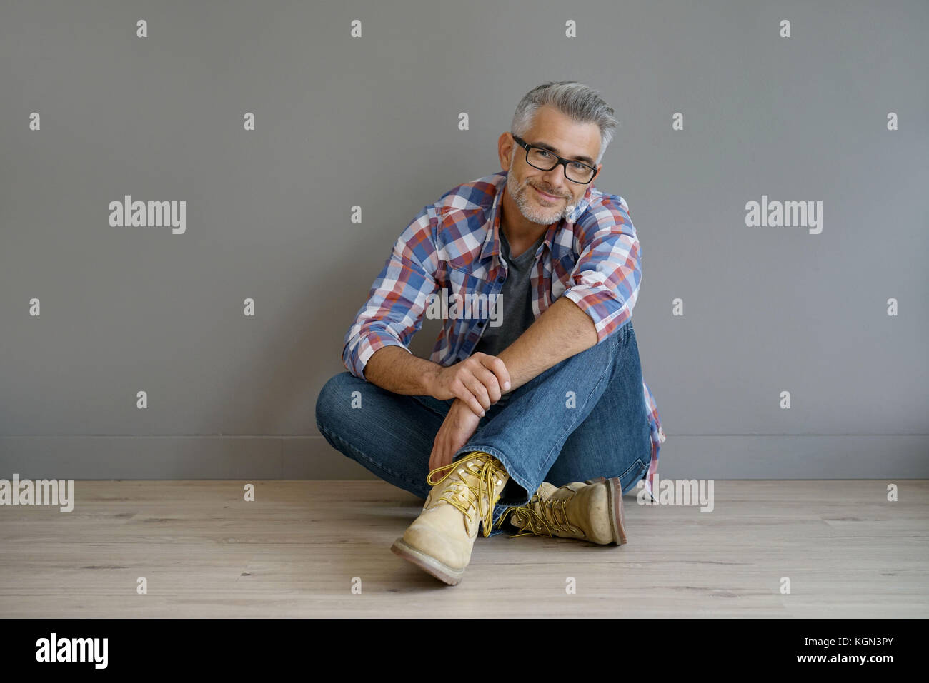 Man sitting on floor isolated hi-res stock photography and images - Alamy