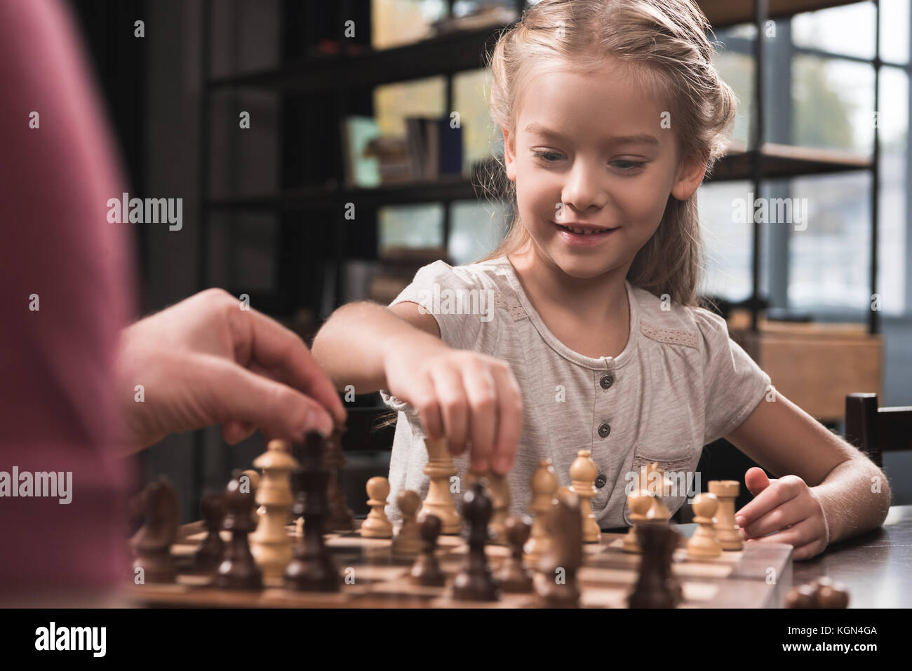 Preschooler kid playing chess Stock Photo - Alamy