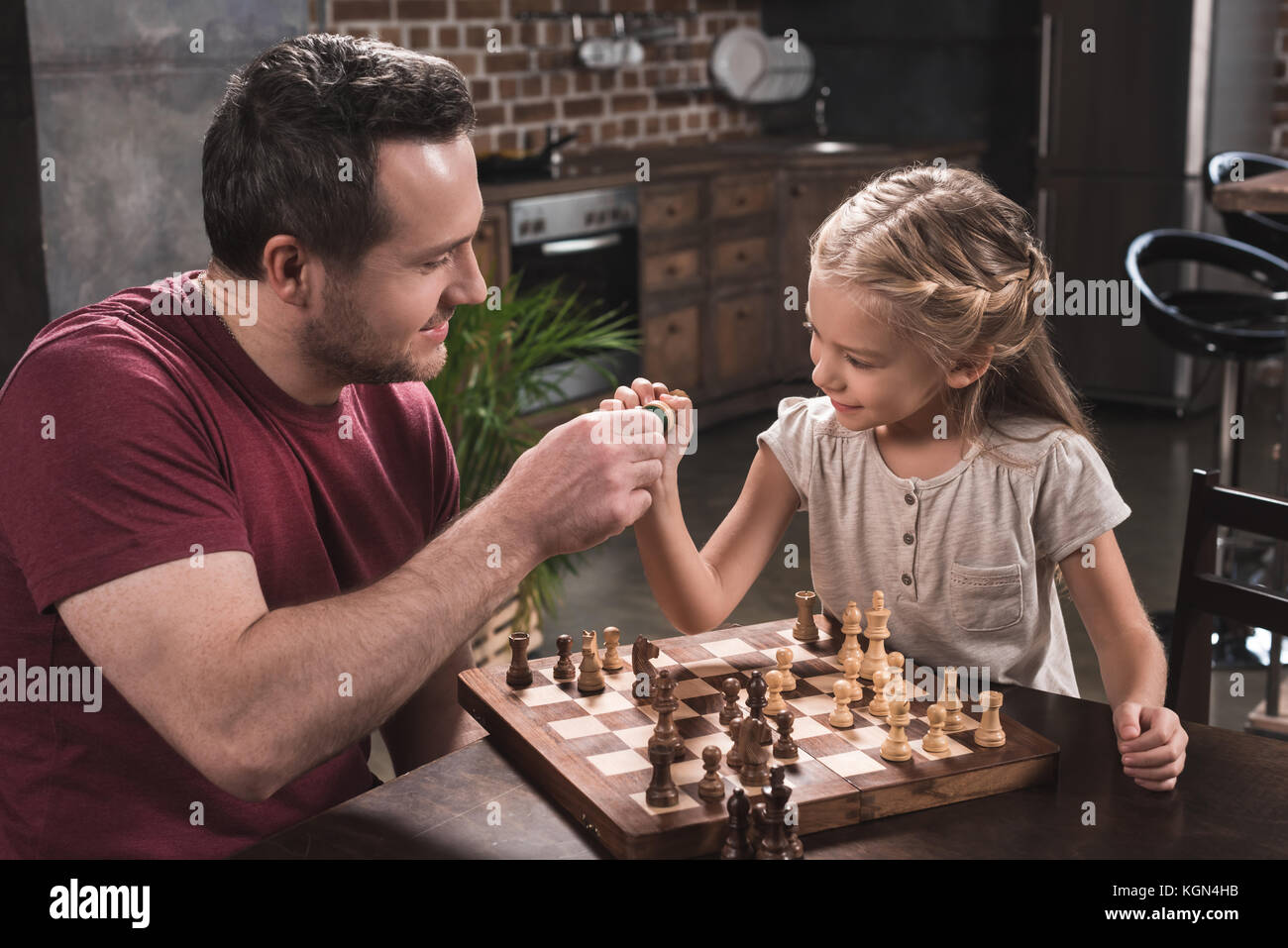 Adorable preschooler girl playing chess hi-res stock photography and ...