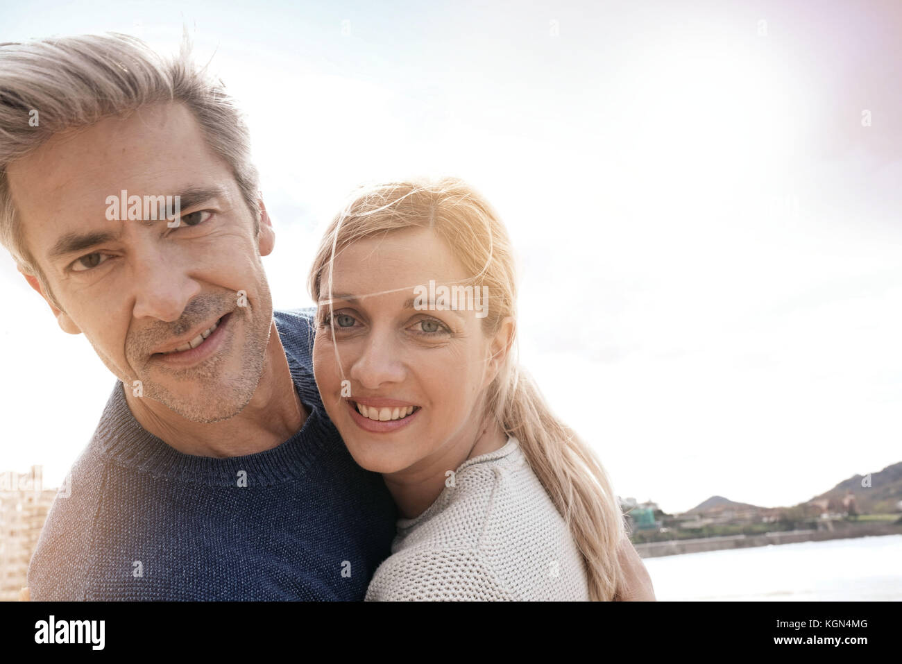 Middle-aged couple embracing each other at the beach Stock Photo - Alamy