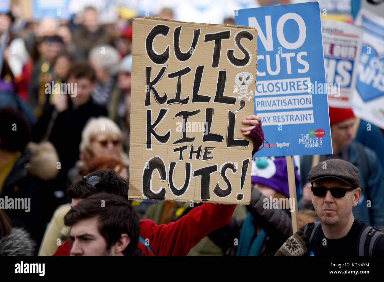 Cuts kill, kill the cuts placard during Our NHS protest demonstration ...