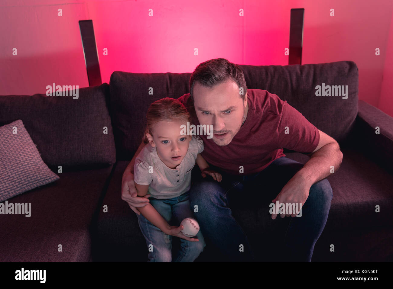 Father and daughter watching baseball game Stock Photo - Alamy