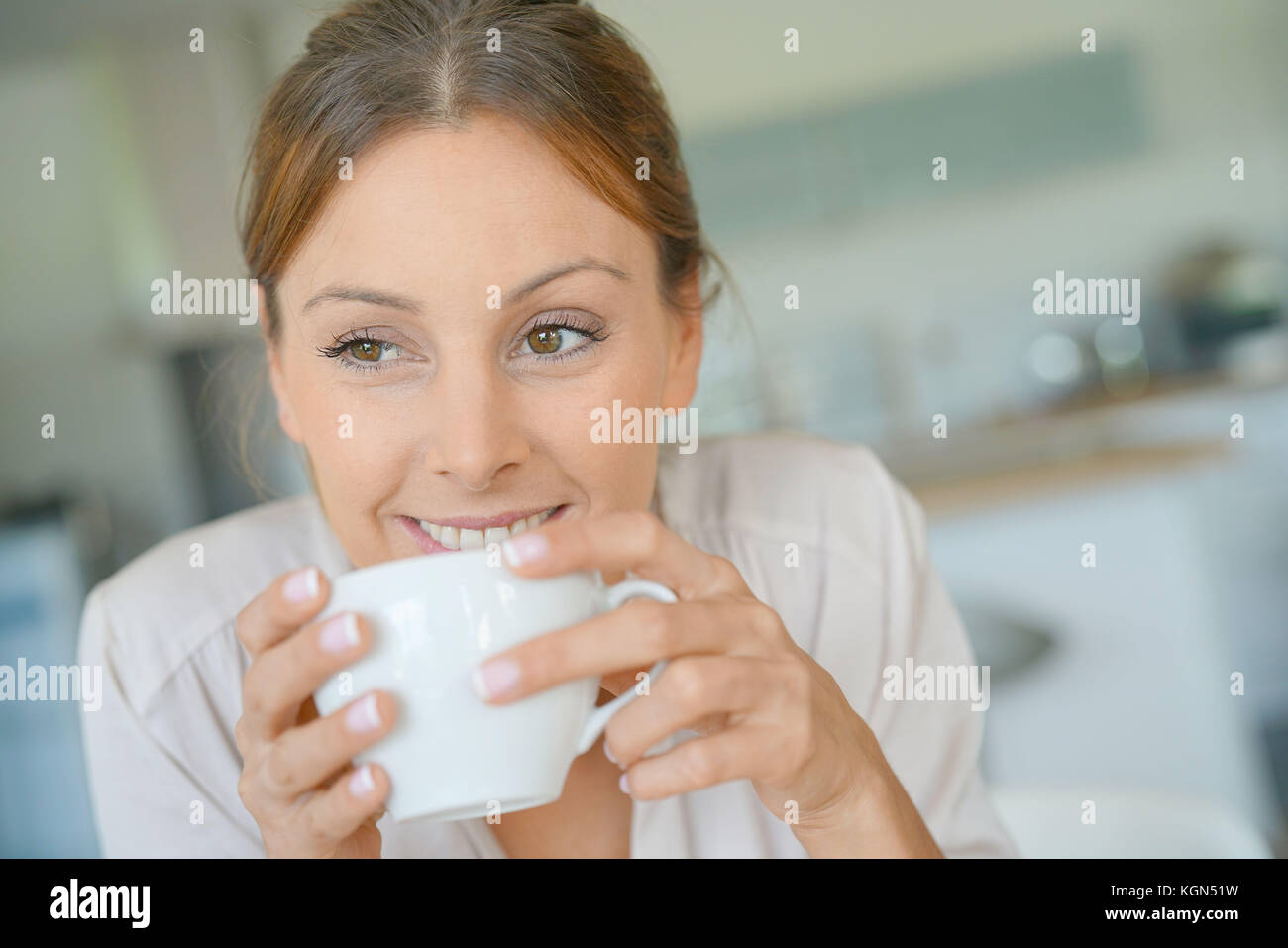 Portrait of beautiful woman at home drinking coffee Stock Photo - Alamy