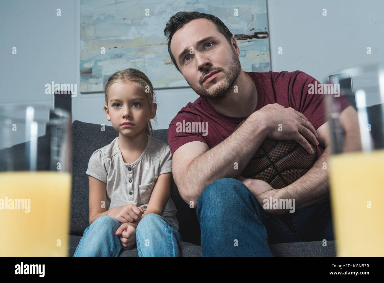 Father and daughter watching basketball game Stock Photo - Alamy