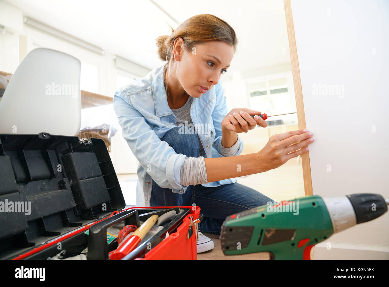 Woman doing DIY work at home Stock Photo - Alamy