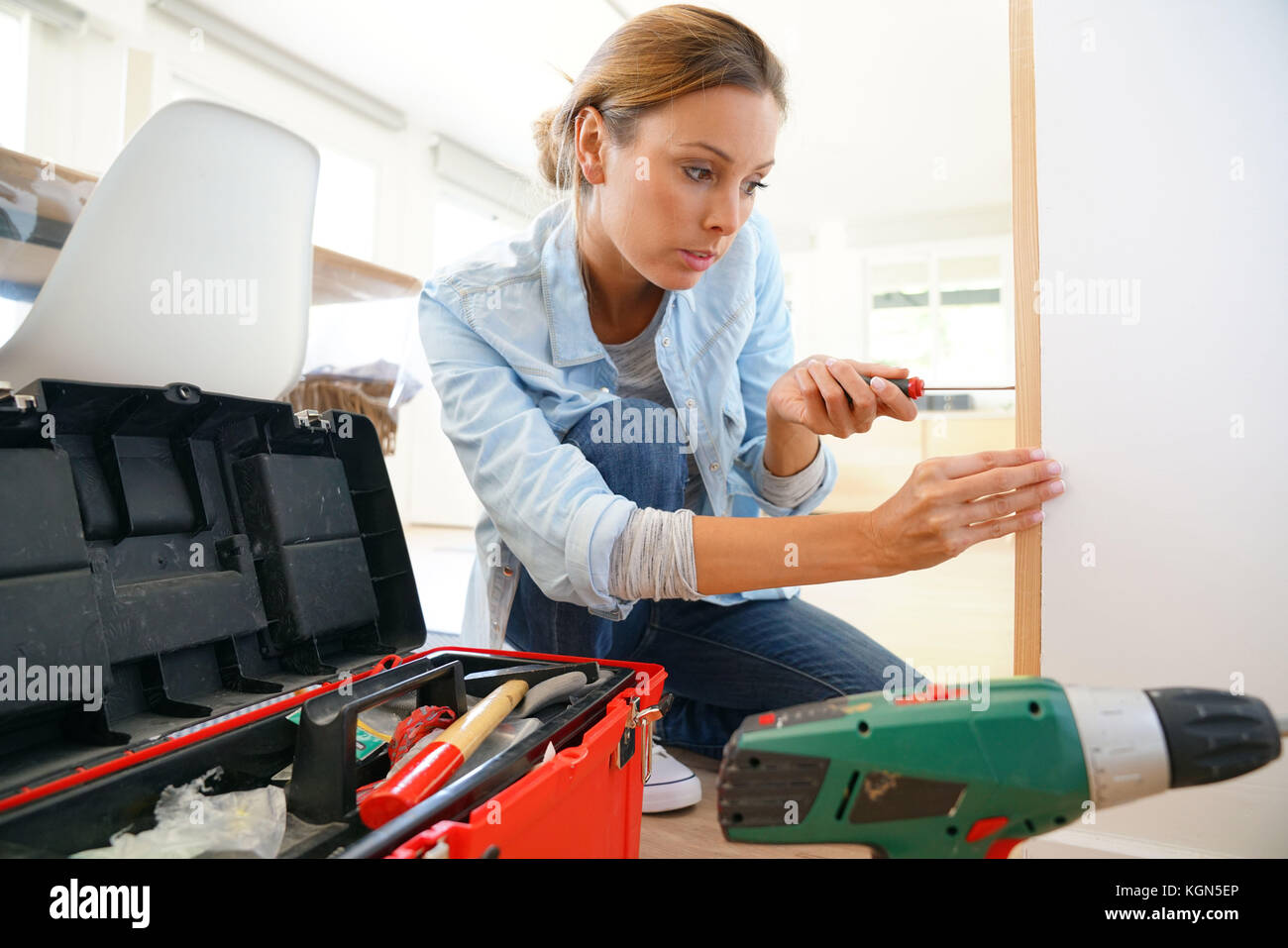Woman toolbox at home hi-res stock photography and images - Alamy