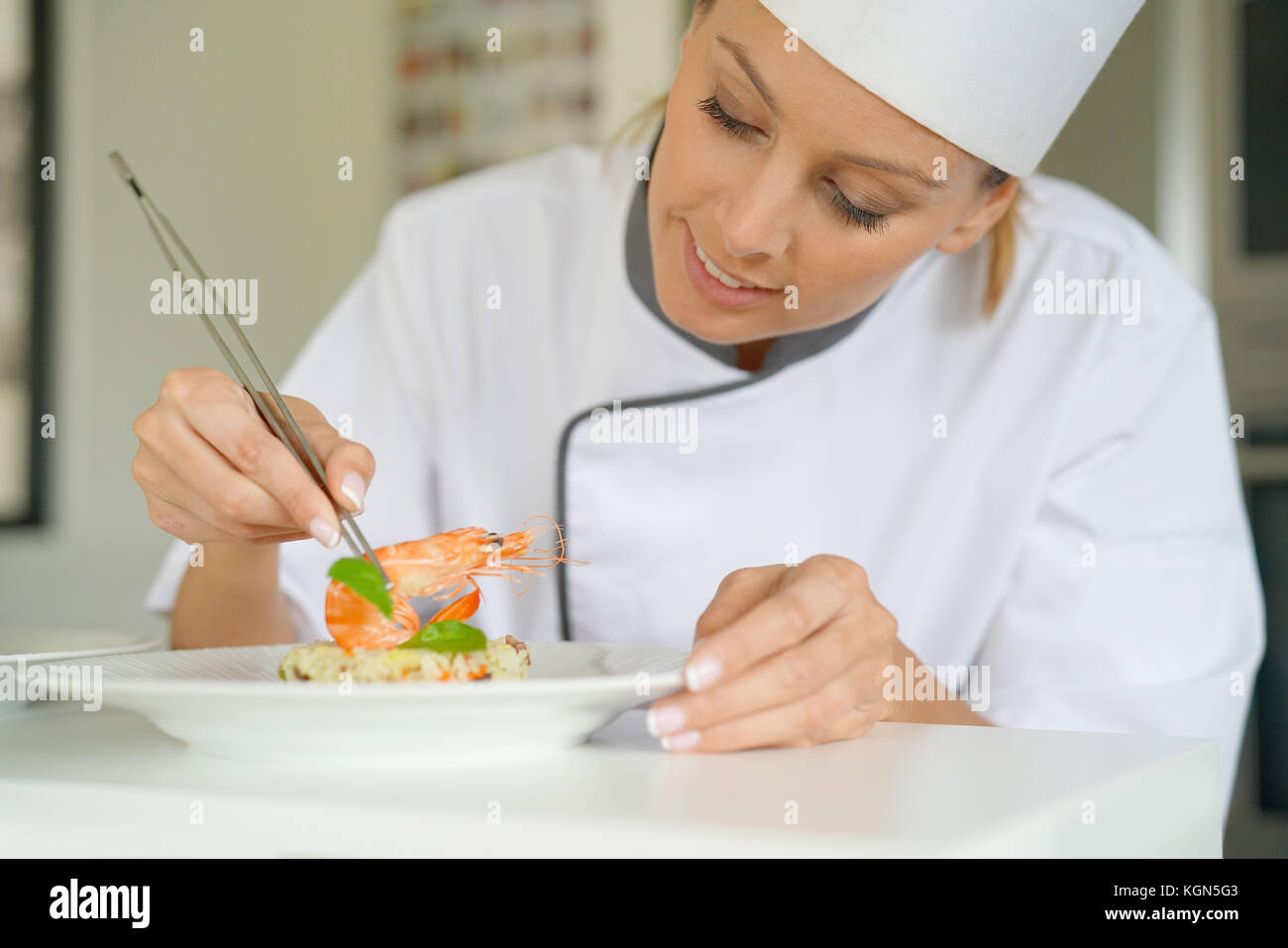 Chef preparing dish in professional kitchen Stock Photo - Alamy